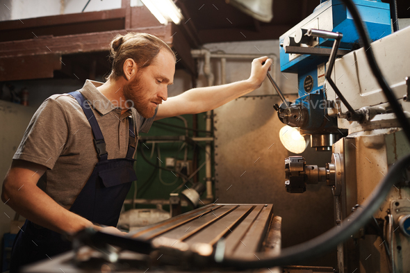 Mechanic controls the machine Stock Photo by AnnaStills | PhotoDune