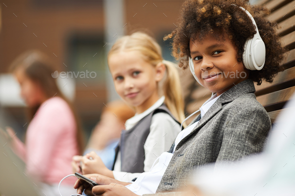 Schoolboy with his classmate outdoors Stock Photo by AnnaStills | PhotoDune
