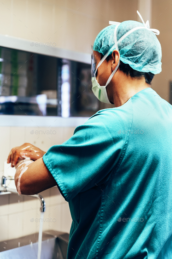 Doctor Washing Hands Before Operating. Stock Photo by nunezimage ...