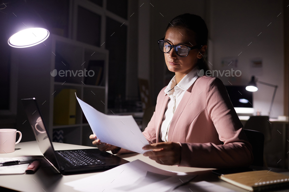 Paperwork till night at office Stock Photo by AnnaStills | PhotoDune