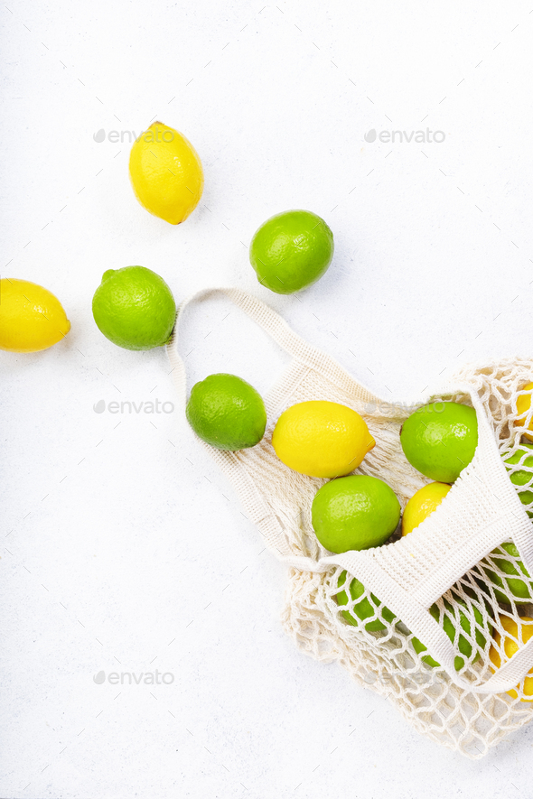 Organic lemons and limes in reusable eco-friendly string mesh bag Stock ...