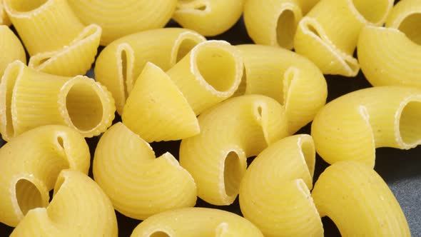Italian macaroni pipe rigate, macro shot in 4k. Rotating motion, view ...