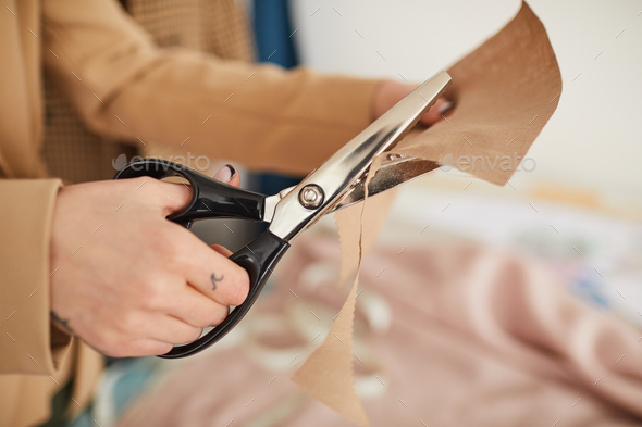 Cutting fabric with scissors Stock Photo by AnnaStills | PhotoDune
