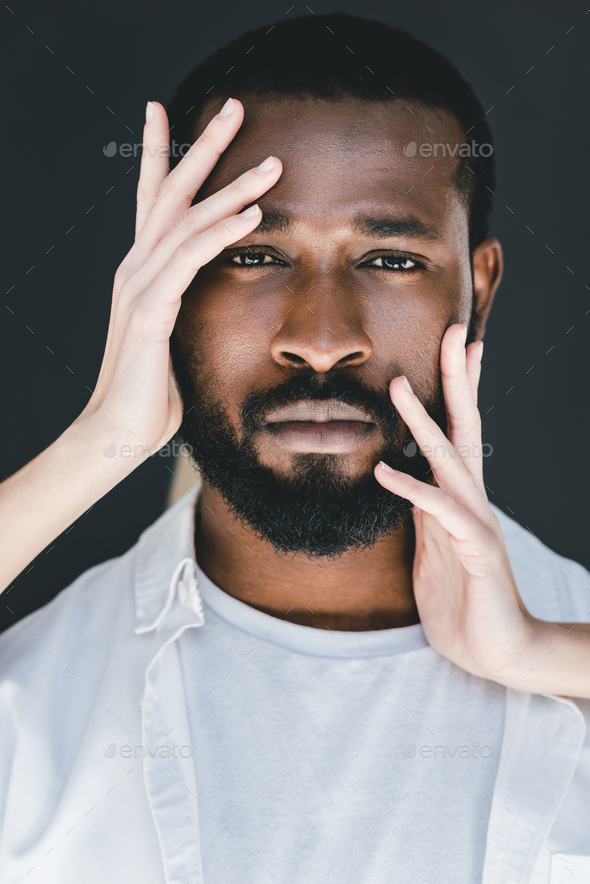 Cropped Image of Girlfriend touching African American Boyfriend Face ...