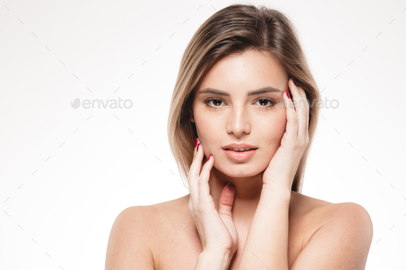Beautiful woman is touching her face by fingers. face portrait close up ...