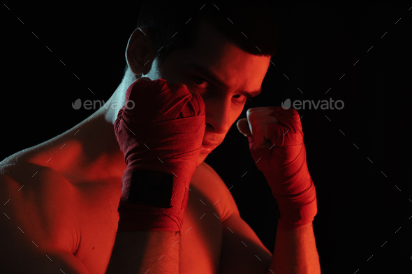 Boxer male fighter posing in confident defensive stance with hands in ...