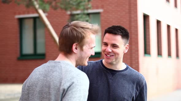 Two men talking and laughing together, Stock Footage | VideoHive