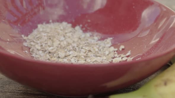 Pouring oats into a bowl, Stock Footage | VideoHive