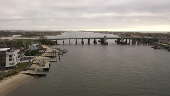 An aerial shot over the East Rockaway Inlet in NY. The drone dolly in ...