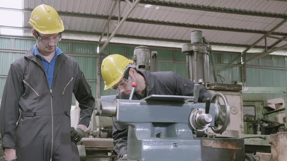 Engineer man training with foreman for apprentice using lathe ...