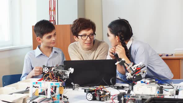 Happy Children Learn Programming Using Laptops on Extracurricular ...