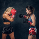 Fight between two professional female boxers Stock Photo by fxquadro