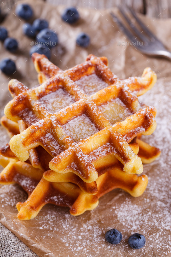 Belgian waffles with blueberries sprinkled with powdered sugar Stock ...