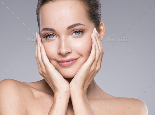 Manicure nails hand touching woman face clean fresh skin Stock Photo by ...