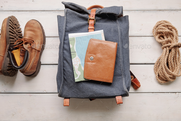 Backpack and map for hiking Stock Photo by Pressmaster | PhotoDune
