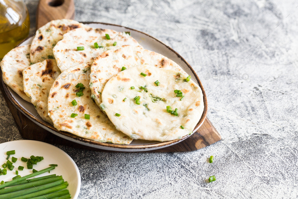 Onion naan - traditional indian bread. pita bread Stock Photo by Ivannag82