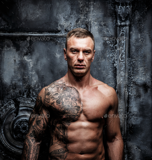 Portrait of muscular male with tattoo. Stock Photo by fxquadro | PhotoDune