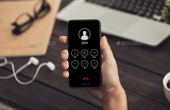 Female Hand Holding Phone With Incoming Call Stock Photo by Prostock-studio