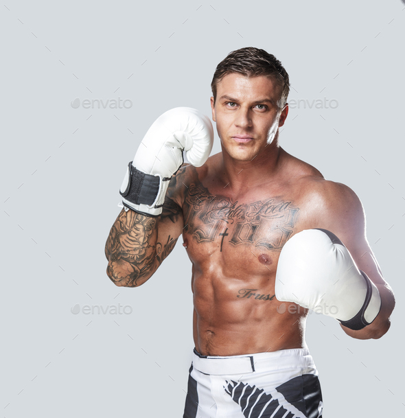 Boxer with tattoo posing in studio Stock Photo by fxquadro | PhotoDune