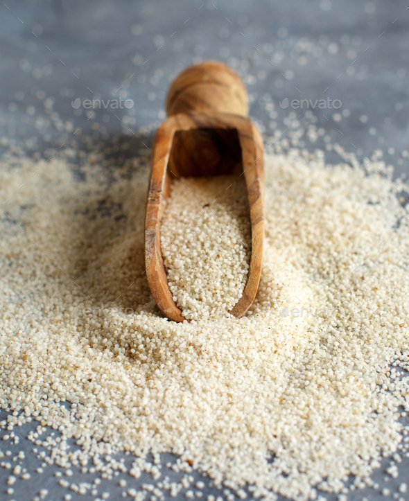 Raw uncooked fonio seeds with a spoon grey background Stock Photo by ...
