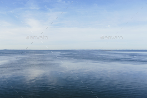 View out to the open sea from the coast. Flat calm water surface. Stock ...