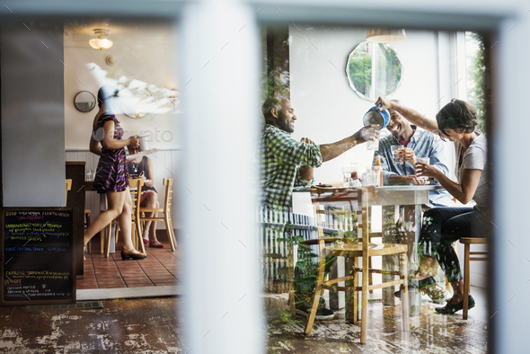 View through a window into a cafe, people sitting at tables. Stock ...