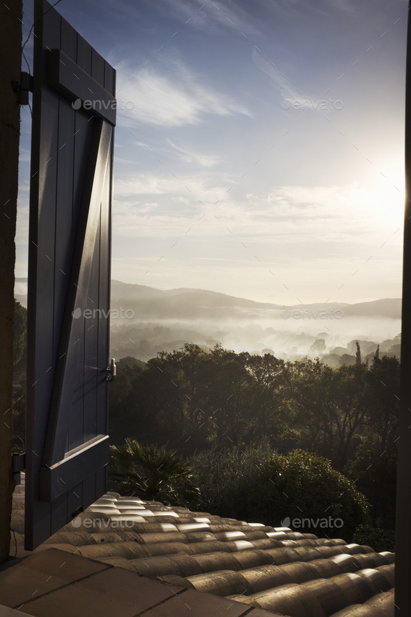 View through an open window, over a lake and mountain landscape. Stock ...