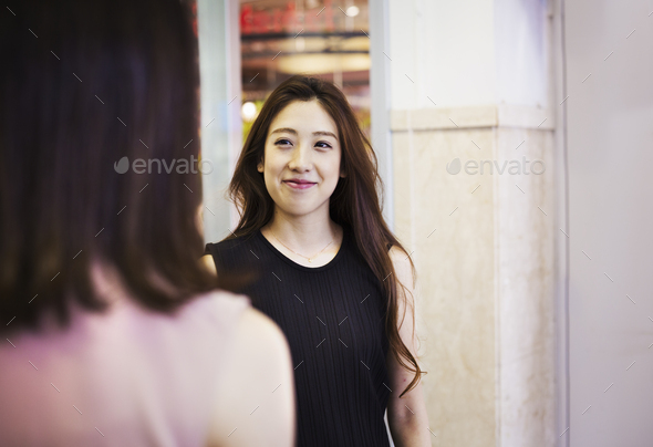 Portrait of a smiling young woman with long brown hair. Stock Photo by ...