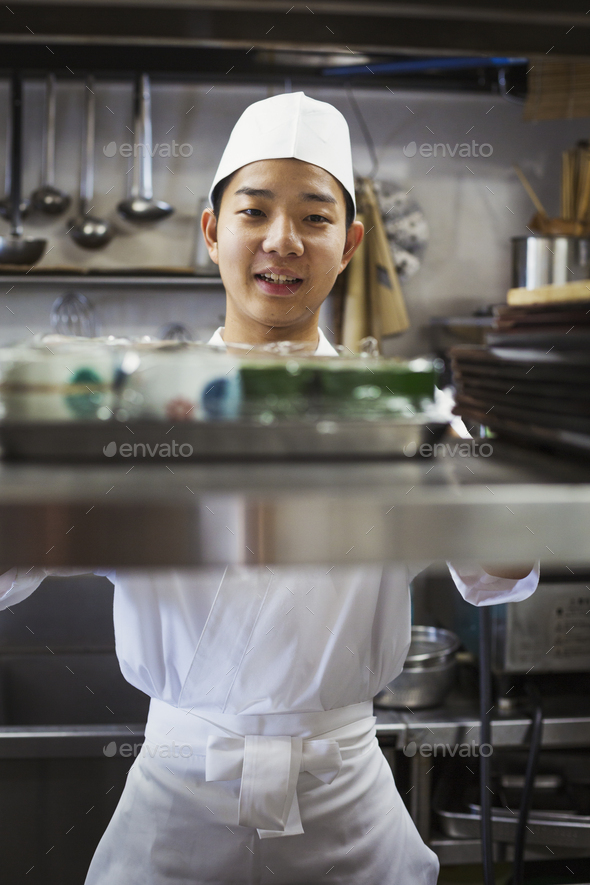 Chef working in the kitchen of a Japanese sushi restaurant. Stock Photo ...