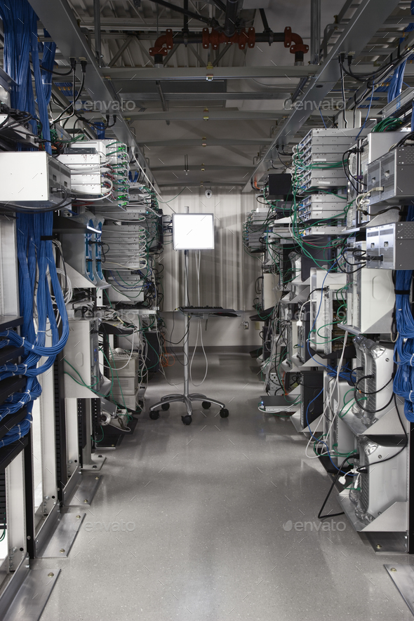 Computer server towers in racks in a computer server farm. Stock Photo ...