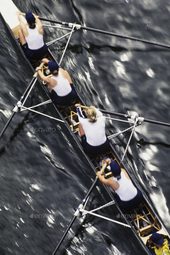 Overhead view of a female rowing crew in their racing shell, rowing ...