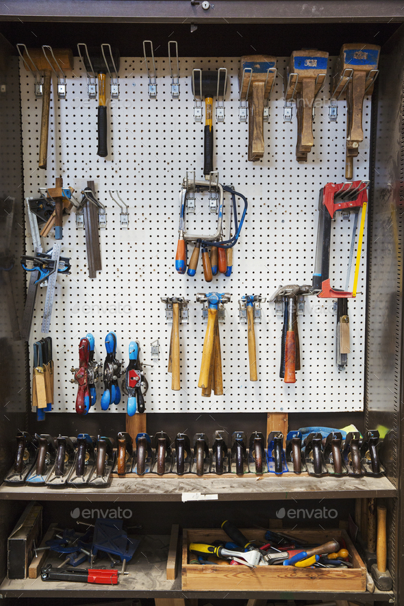 Work bench in a boat-builder's workshop, selection of hand tools for ...