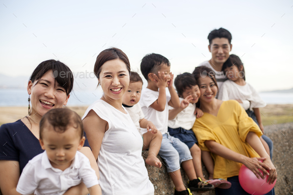 Group portrait of Japanese families with young children on promenade by ...