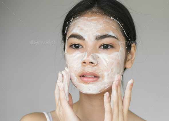 Soap face Young beautiful woman washing her face Stock Photo by kiraliffe