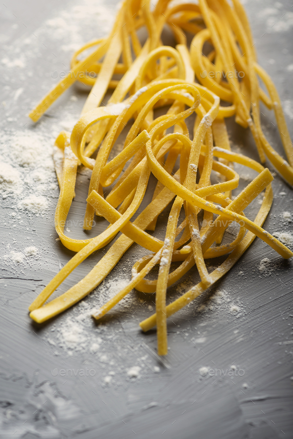 Traditional italian raw pasta with eggs Stock Photo by OxanaDenezhkina