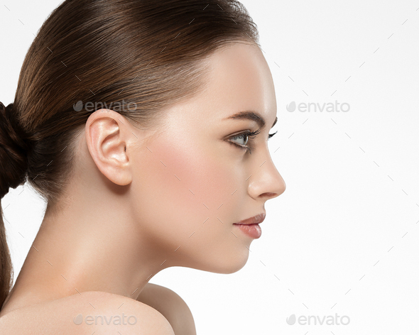 Beautiful woman face closeup portrait profile Stock Photo by kiraliffe