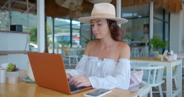 Young Woman Writing the Text on Lap Top Computer She Seats at Cafe ...
