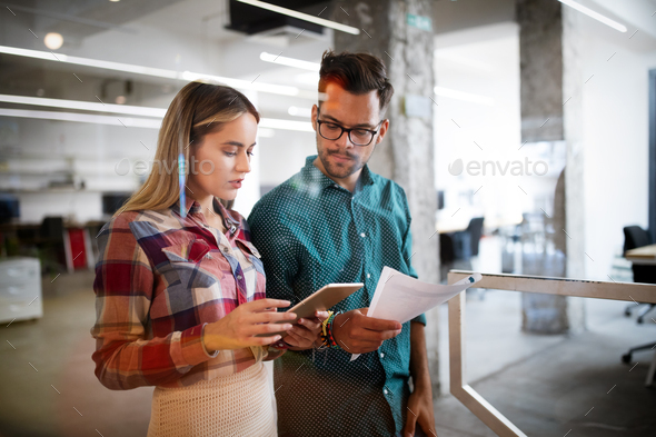 Creative professional designers brainstorming in office. Business ...