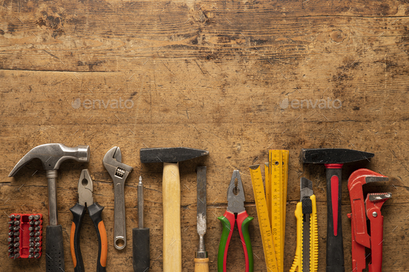 Old work hand tools on a vintage wooden background Stock Photo by Nick ...