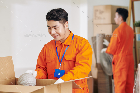 Modern Moving Men At Work Stock Photo by DragonImages | PhotoDune