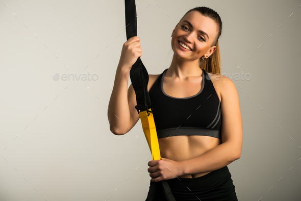Beautiful positive young girl fitness model Stock Photo by YouraPechkin