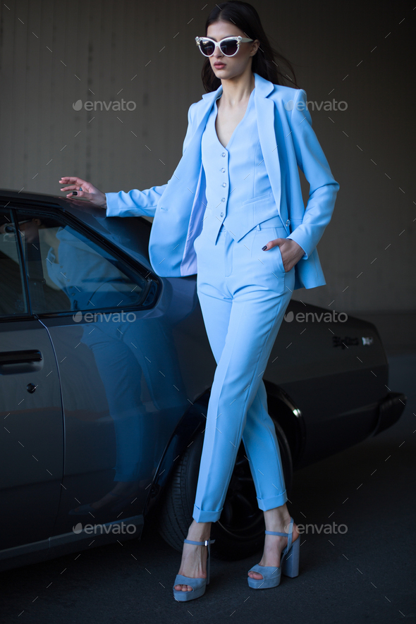 Mafia lady outside old school car in the sea port. Fashion girl ...