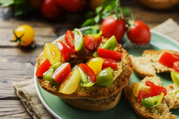 Traditional italian bread frisella with tomatos Stock Photo by ...