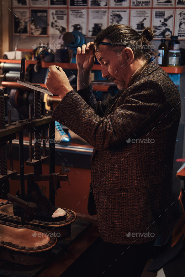 Bootmaker at work - he got a new progect Stock Photo by fxquadro ...