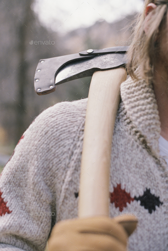Close up of a man carrying an axe on his shoulder. Stock Photo by Mint ...