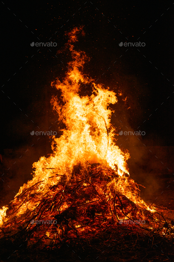 Top of a giant bonfire burning in the night Stock Photo by rubenchase