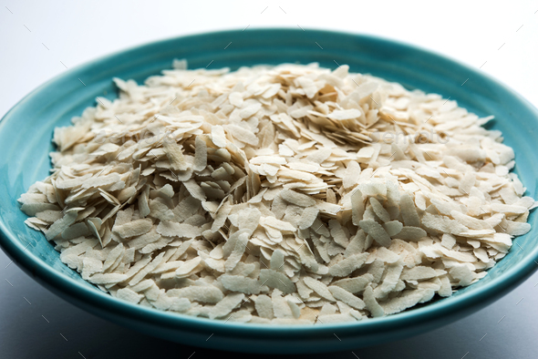 Puffed Rice Poha - Uncooked or Raw, selective focus Stock Photo by ...