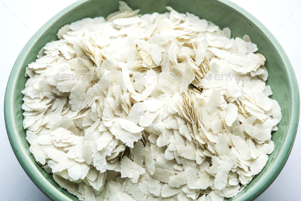 Puffed Rice Poha - Uncooked or Raw, selective focus Stock Photo by ...