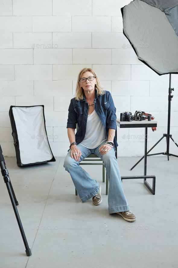 Female photographer in photo studio Stock Photo by Pressmaster | PhotoDune