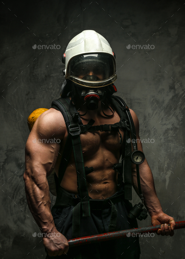 Muscular firefighter with axe Stock Photo by fxquadro | PhotoDune